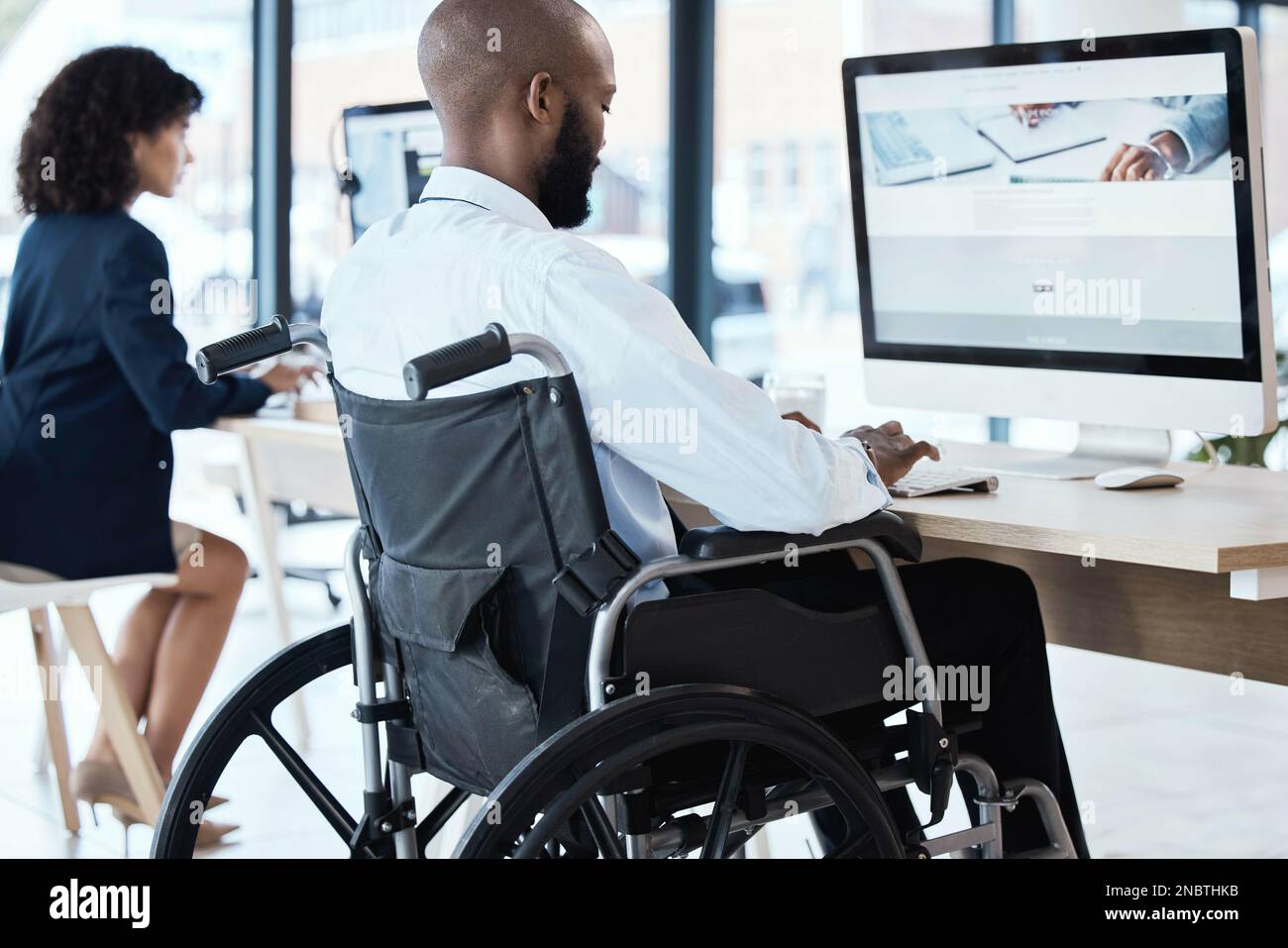 Wheelchair, office and black man disability in the workplace doing ...