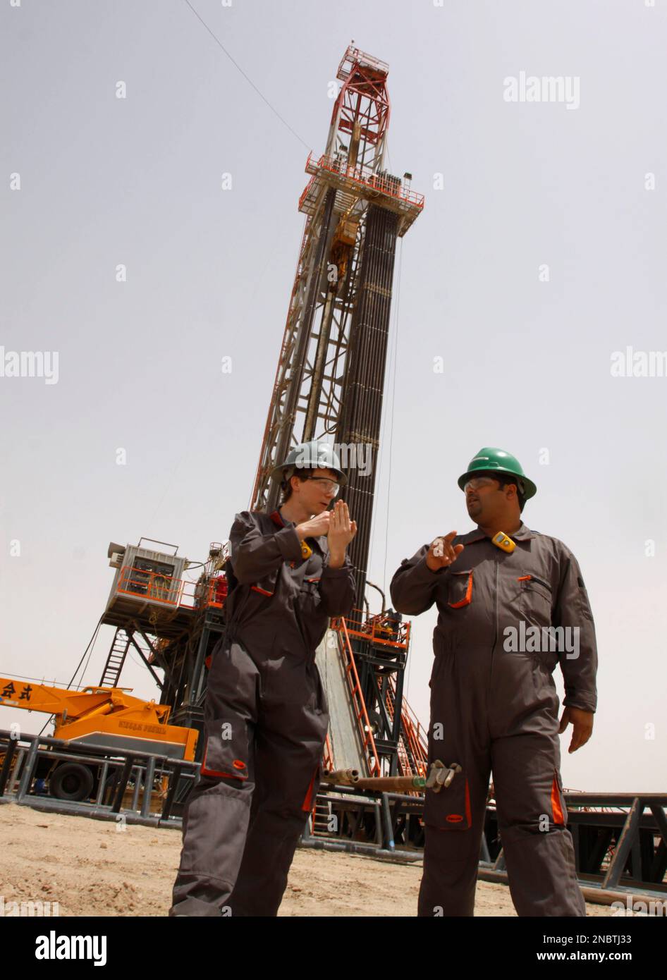Oil workers are seen at Zubair oil field near Basra, 550 kilometers ...
