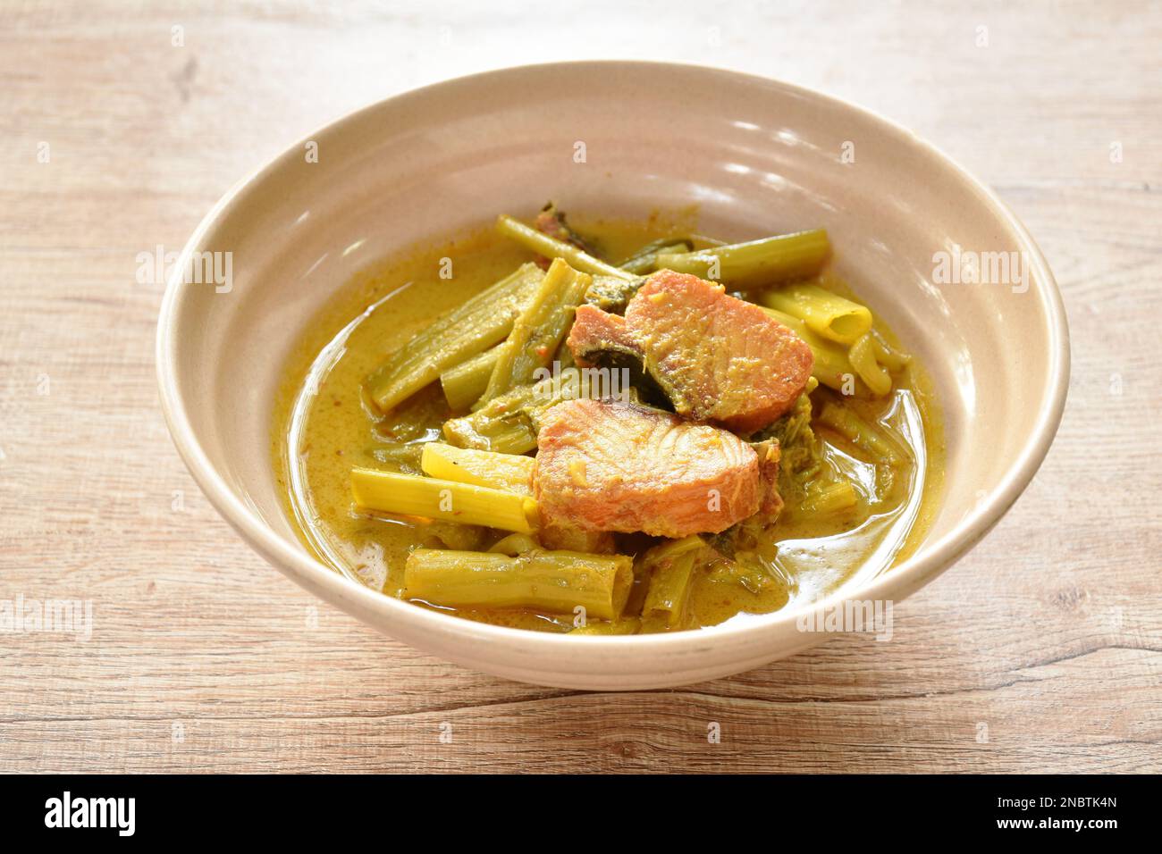 boiled dry salty mackerel fish with morning glory and pineapple in ...