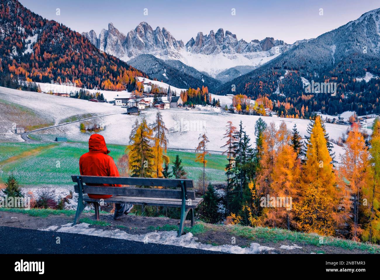Tourist admiring of the great view of snowy hills on Santa Magdalena ...