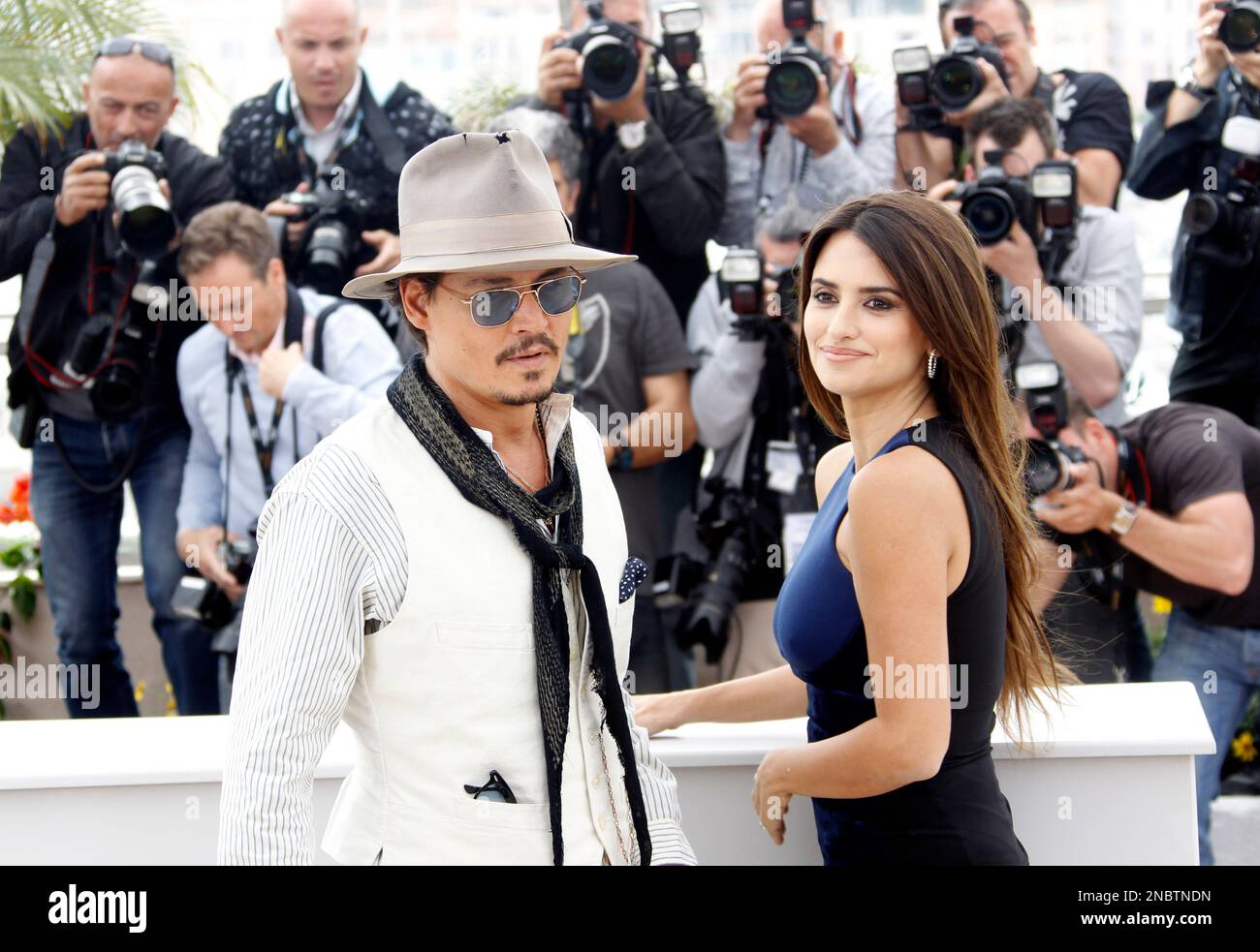 Actors Johnny Depp, left, and Penelope Cruz pose during a photo call ...