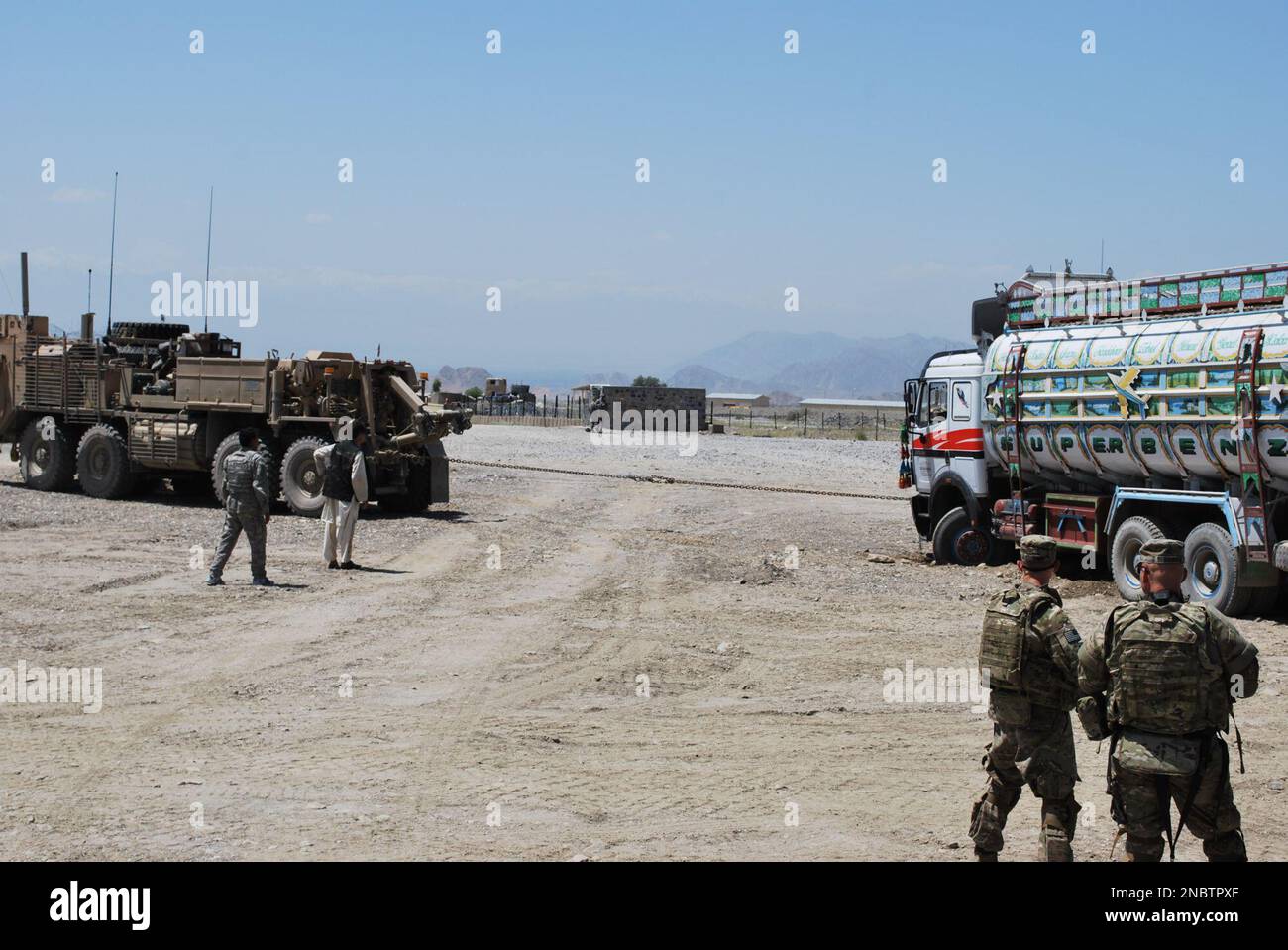 In an April 26, 2011 photo, U.S. Army wrecker vehicles help to pull an ...
