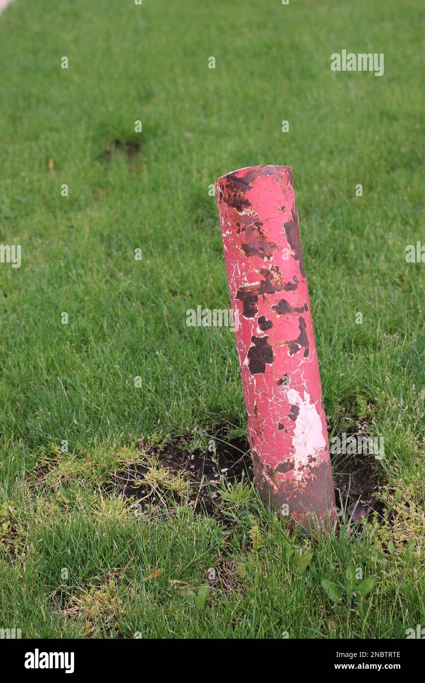 Solid steel post standing in the fields Stock Photo - Alamy