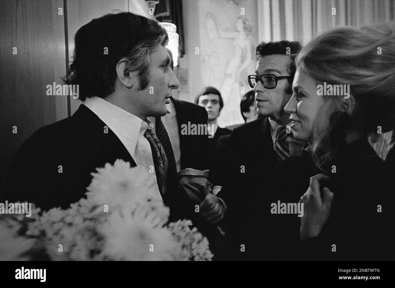 German socialite and industrialist Gunter Sachs, left, presents his ...