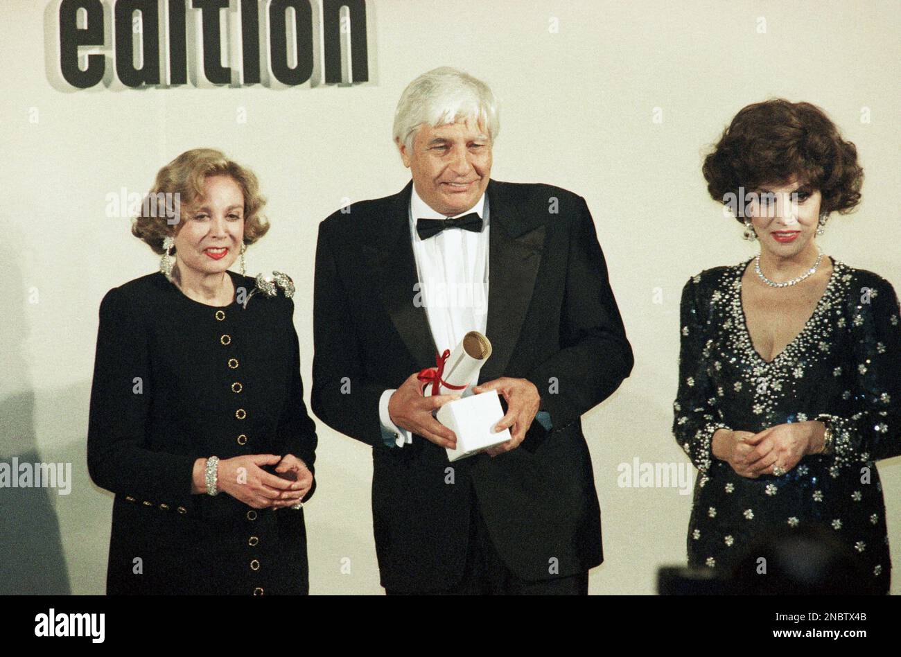 German socialite and industrialist Gunter Sachs, center, poses with ...