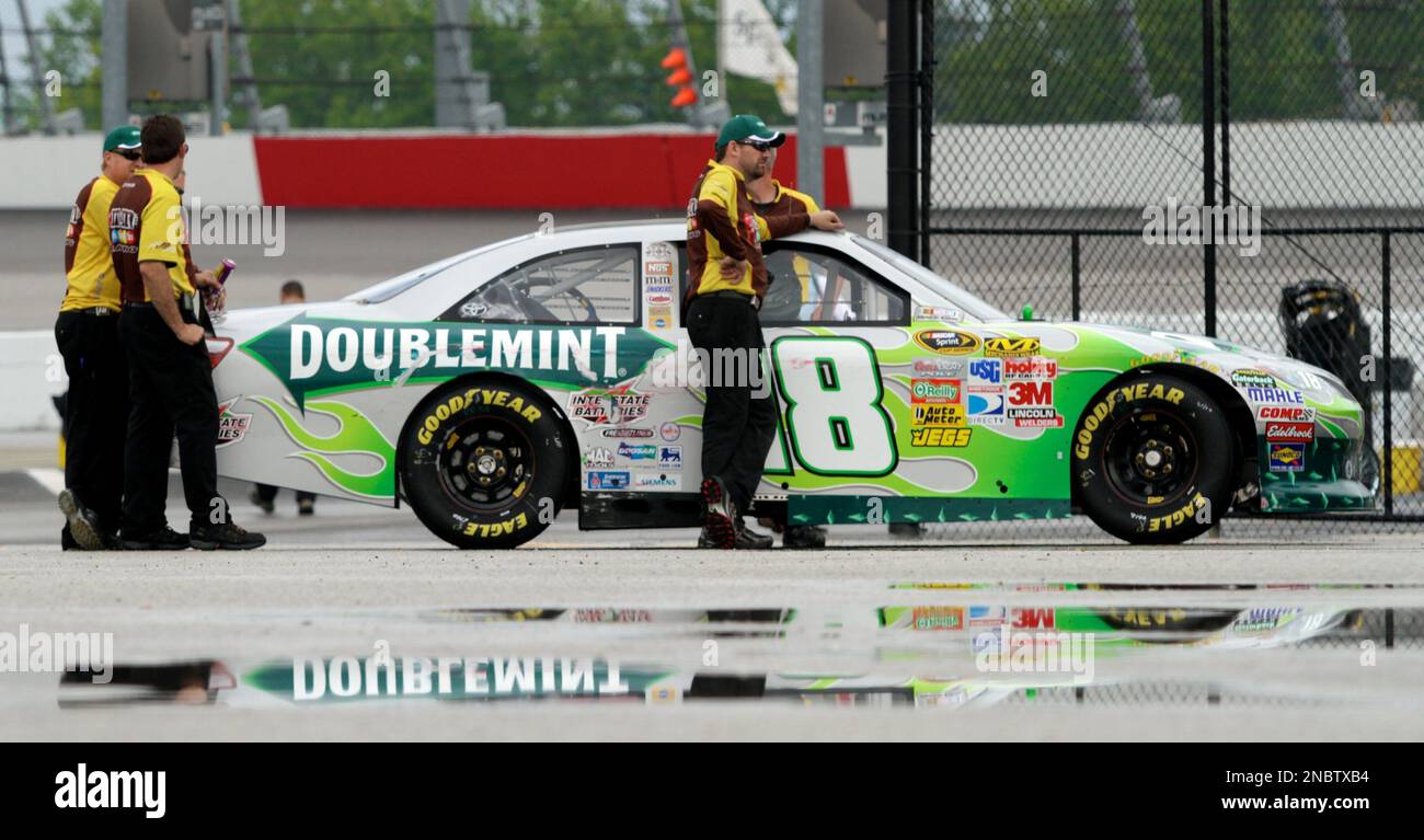 Crew members wait for Kyle Busch's car to be inspected by NASCAR Sprint ...
