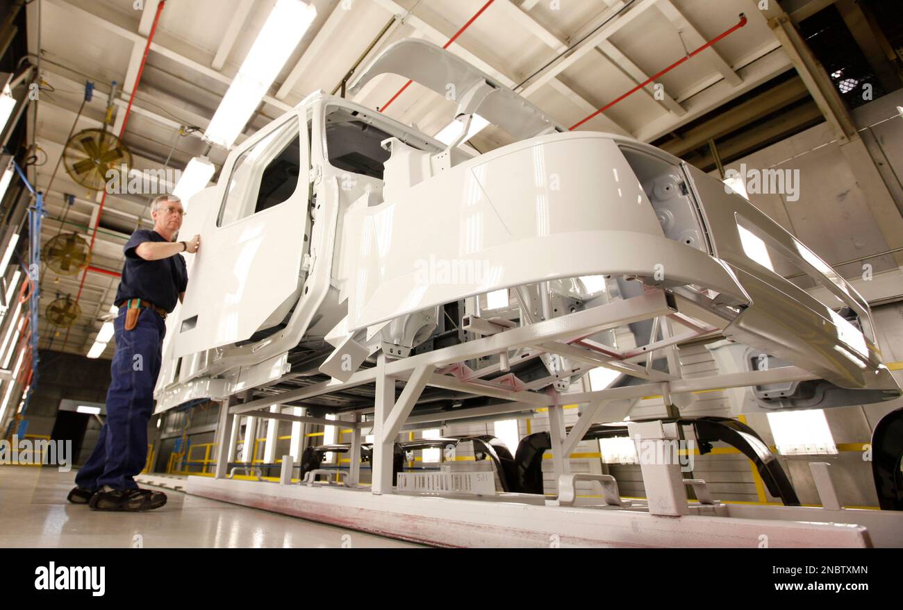Donald Edmonds does a paint inspection on a truck cab on the Volvo ...