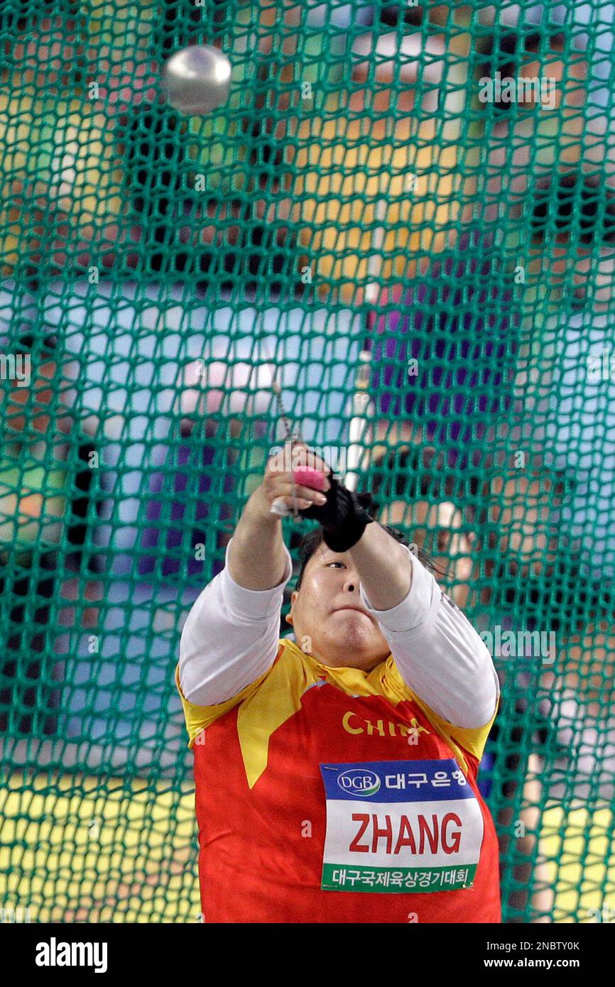 Winner Wenxiu Zhang of China competes in the women's hammer throw of ...