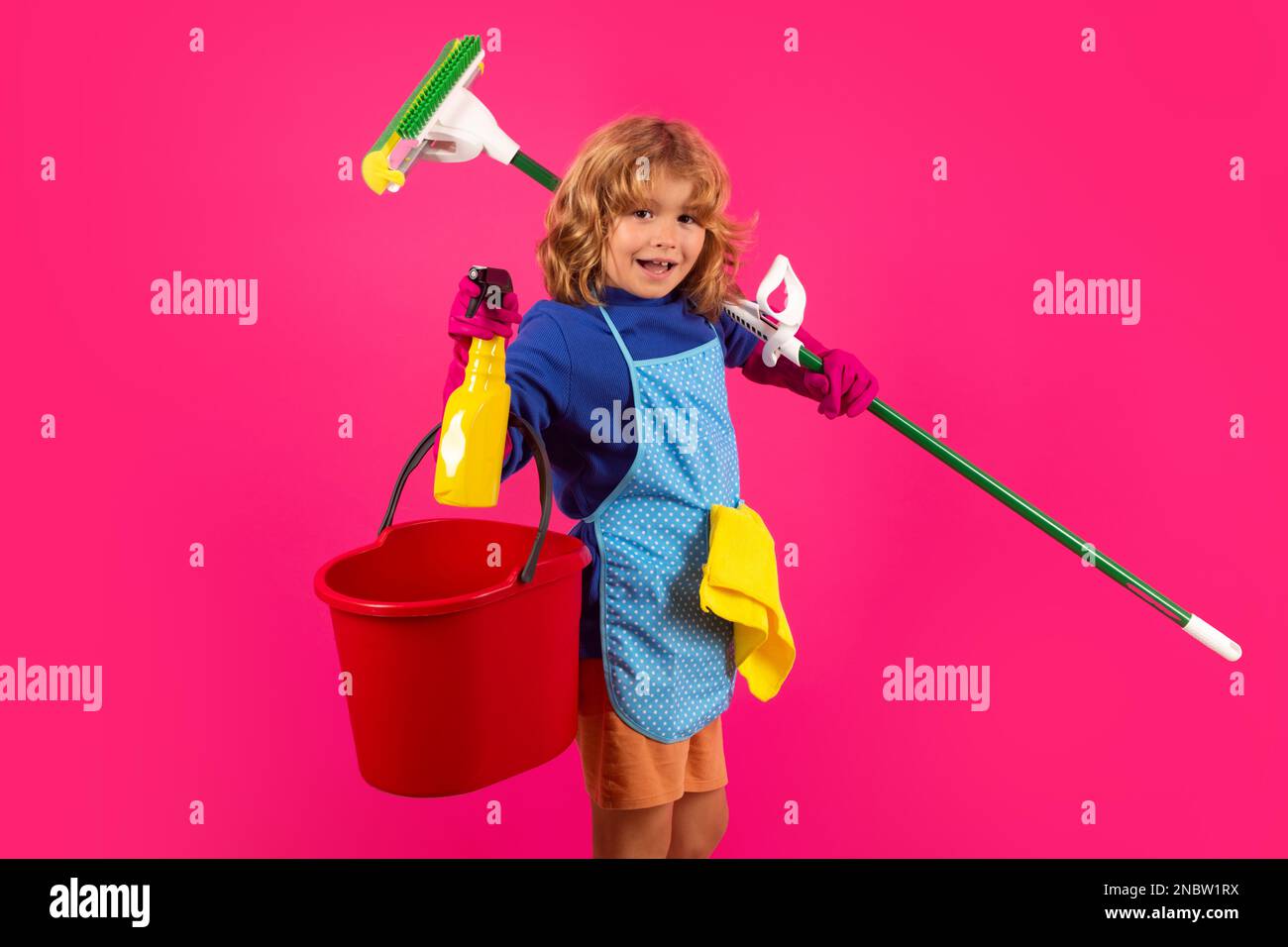 Child cleans at home concept. Kid cleaning with mop to help with ...