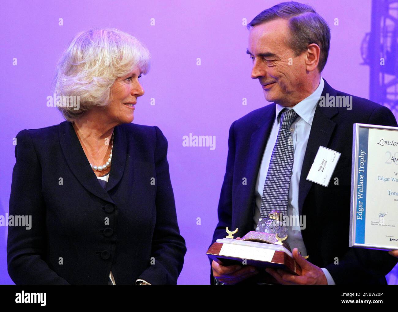 Britain's Camilla, Duchess of Cornwall presents Tom Utley of The Daily ...