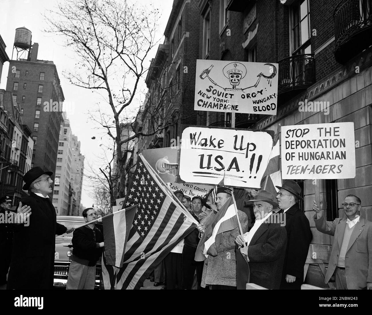 Carrying posters and an American flag, striking members of the ...