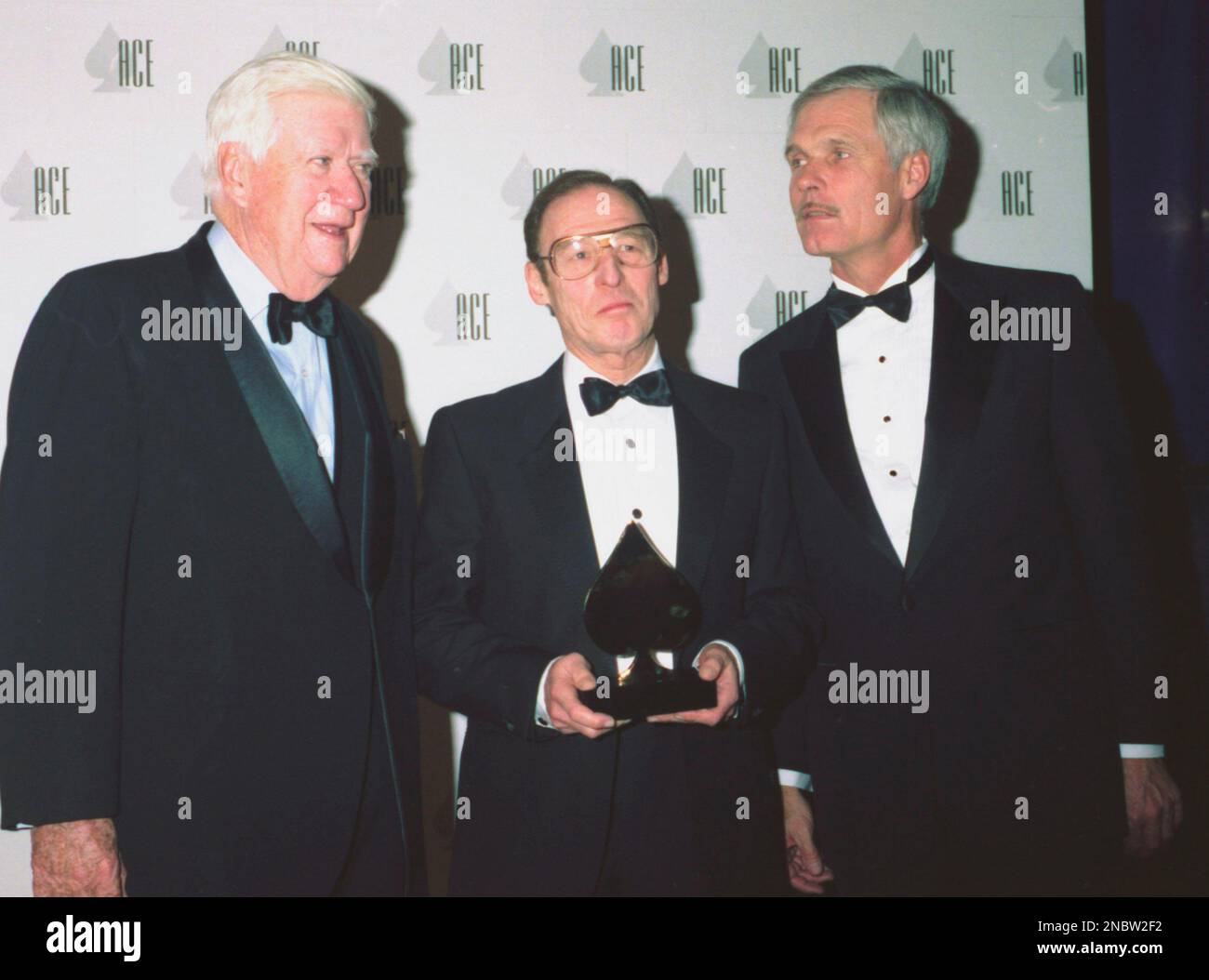 FILE - In a Jan. 14, 1990 file photo, Burt Reinhardt, center, President ...