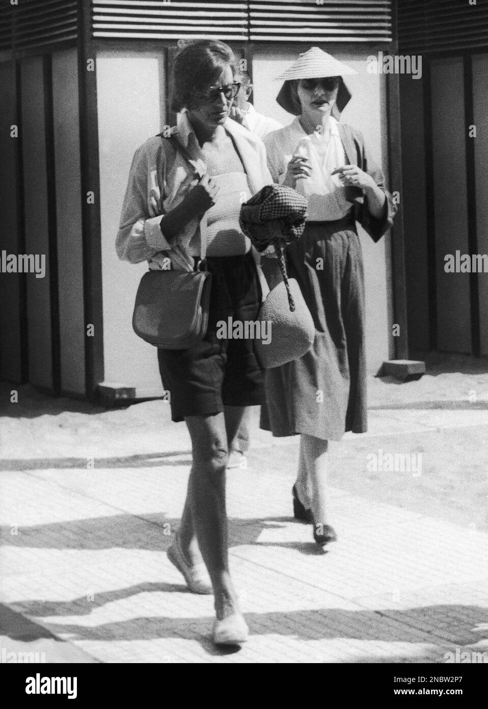 Looking disheveled, Swedish-born film actress Greta Garbo in shorts and ...