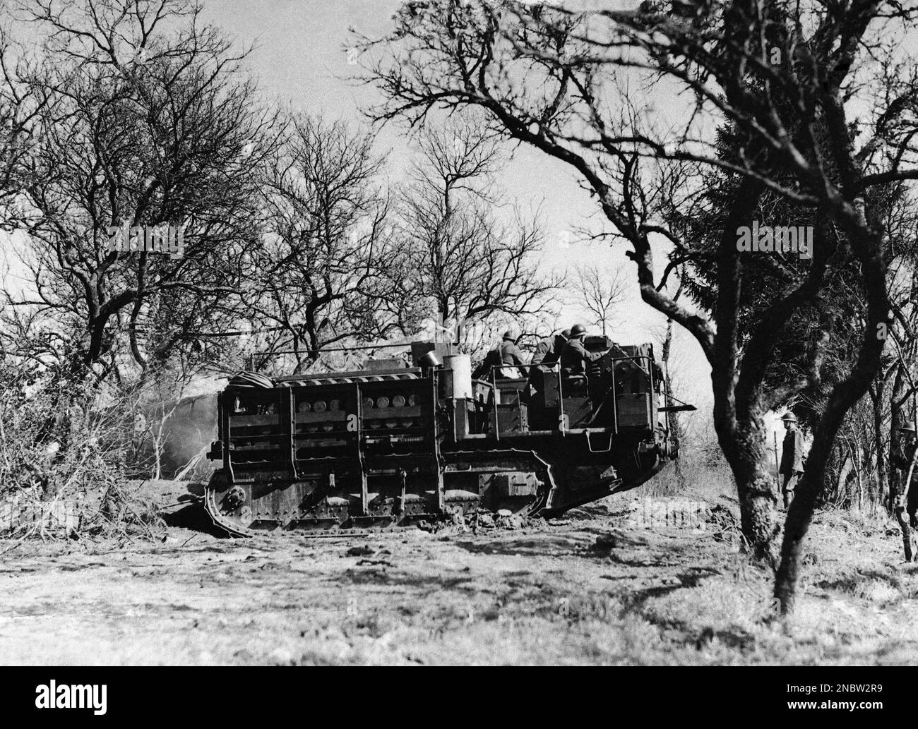 French caterpillar tractor laden with shells, moving up to a forward ...