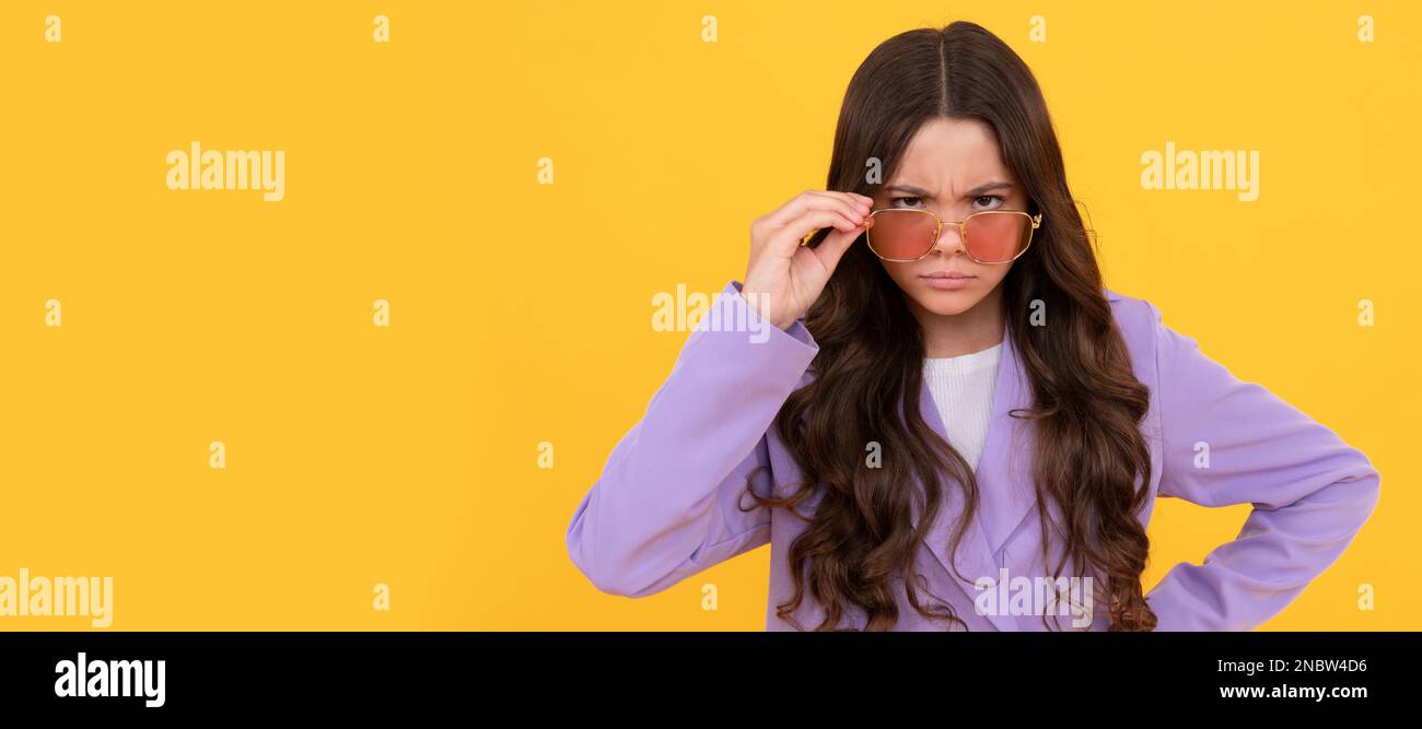 keep under control. serious kid with curly hair in sunglasses. beauty ...