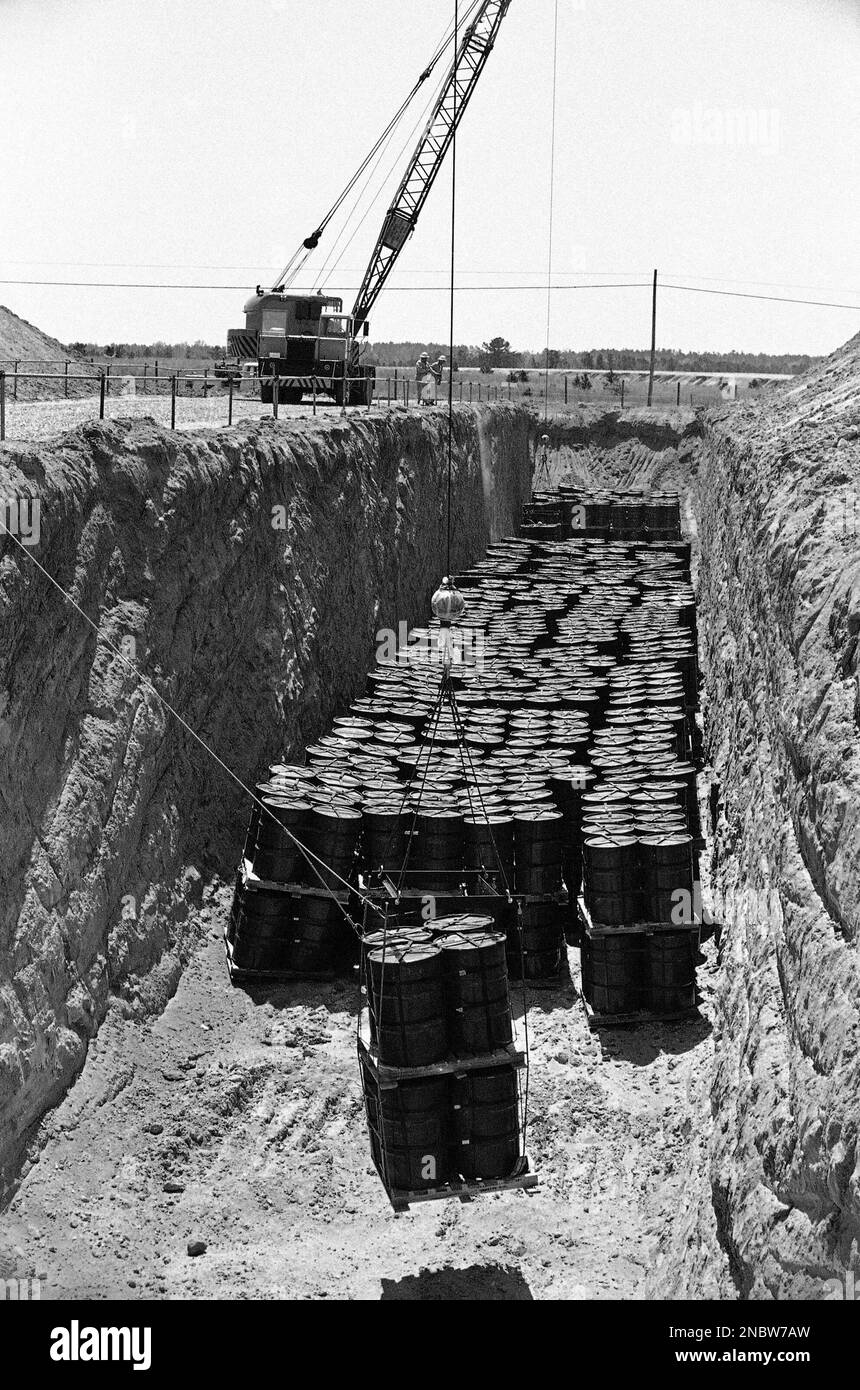Steel drums containing mildly radioactive Spanish soil are unloaded ...