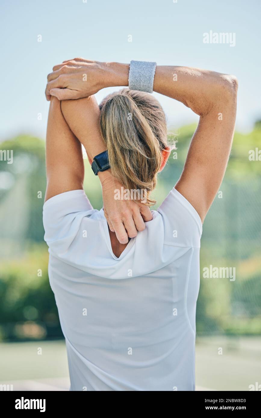 Tennis, back and stretching arm with a sports woman on a court for a ...