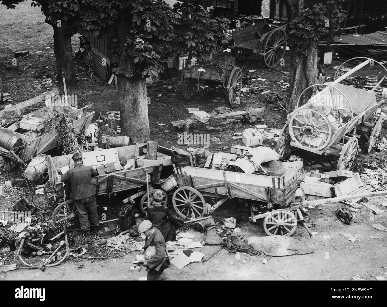 Civilians going through what is left during World War II in France, Aug ...