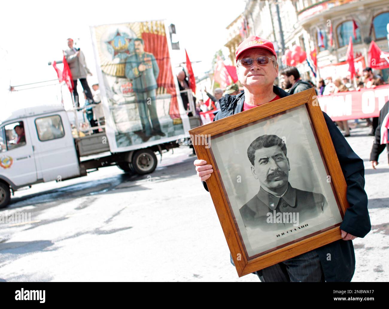 A man carry a portrait of Sovied Dictator Josef Stalin during the ...