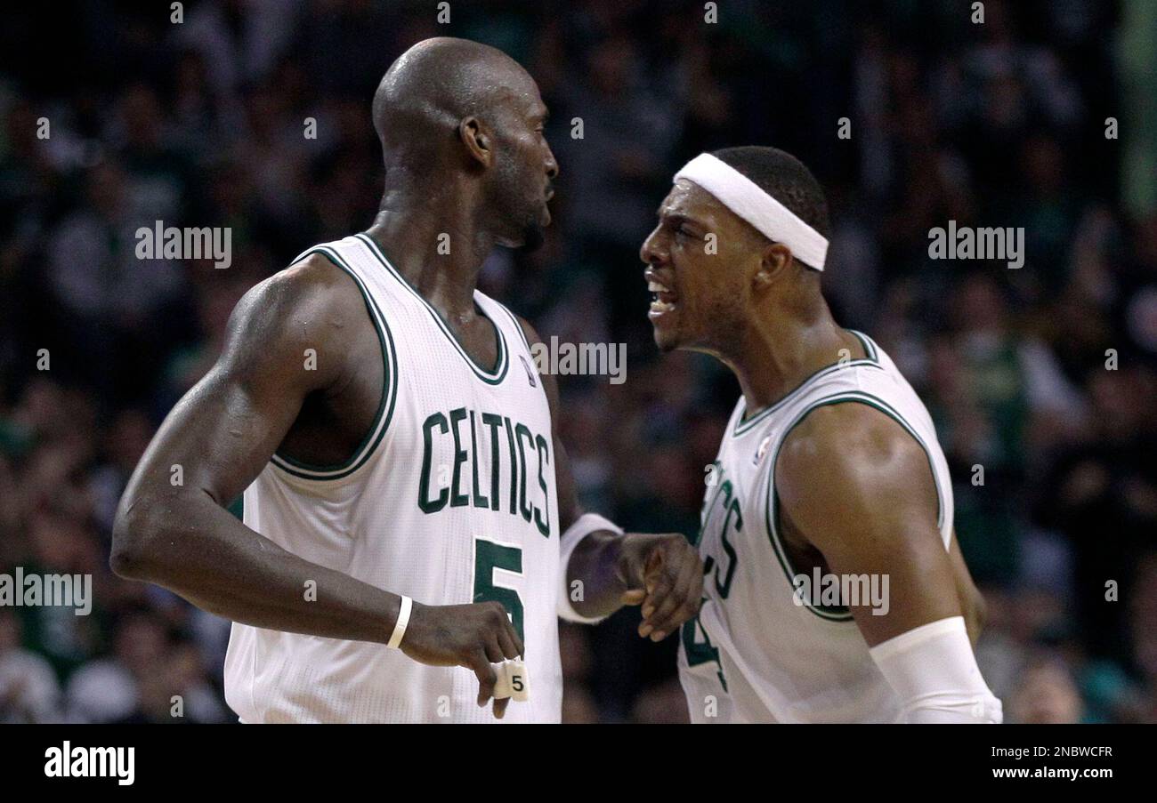 Boston Celtics forward Paul Pierce, right, and teammate Kevin Garnett celebrate after a basket ...
