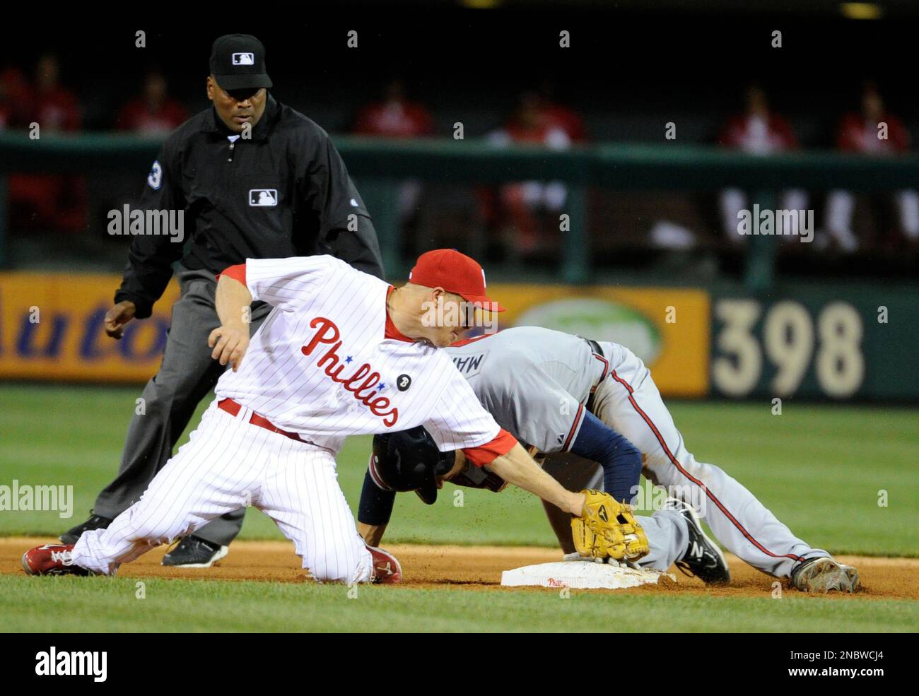 Atlanta Braves' Joe Mather, right, is safe at second on a double as ...