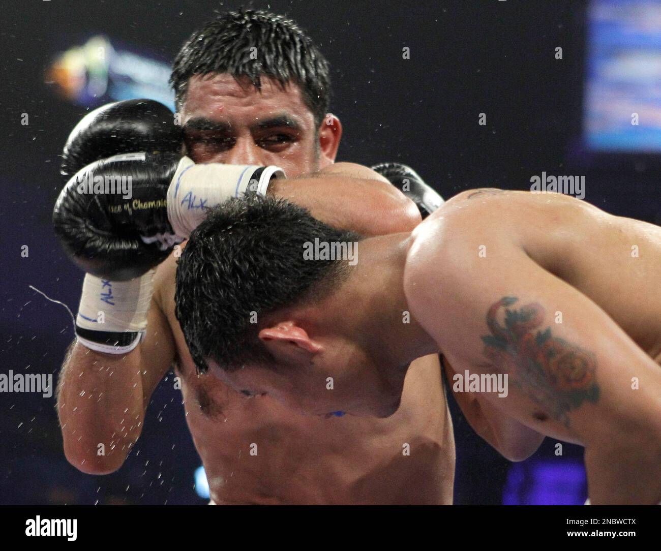 Rodel Mayol, right, of the Philippines, exchanges punches with Javier ...