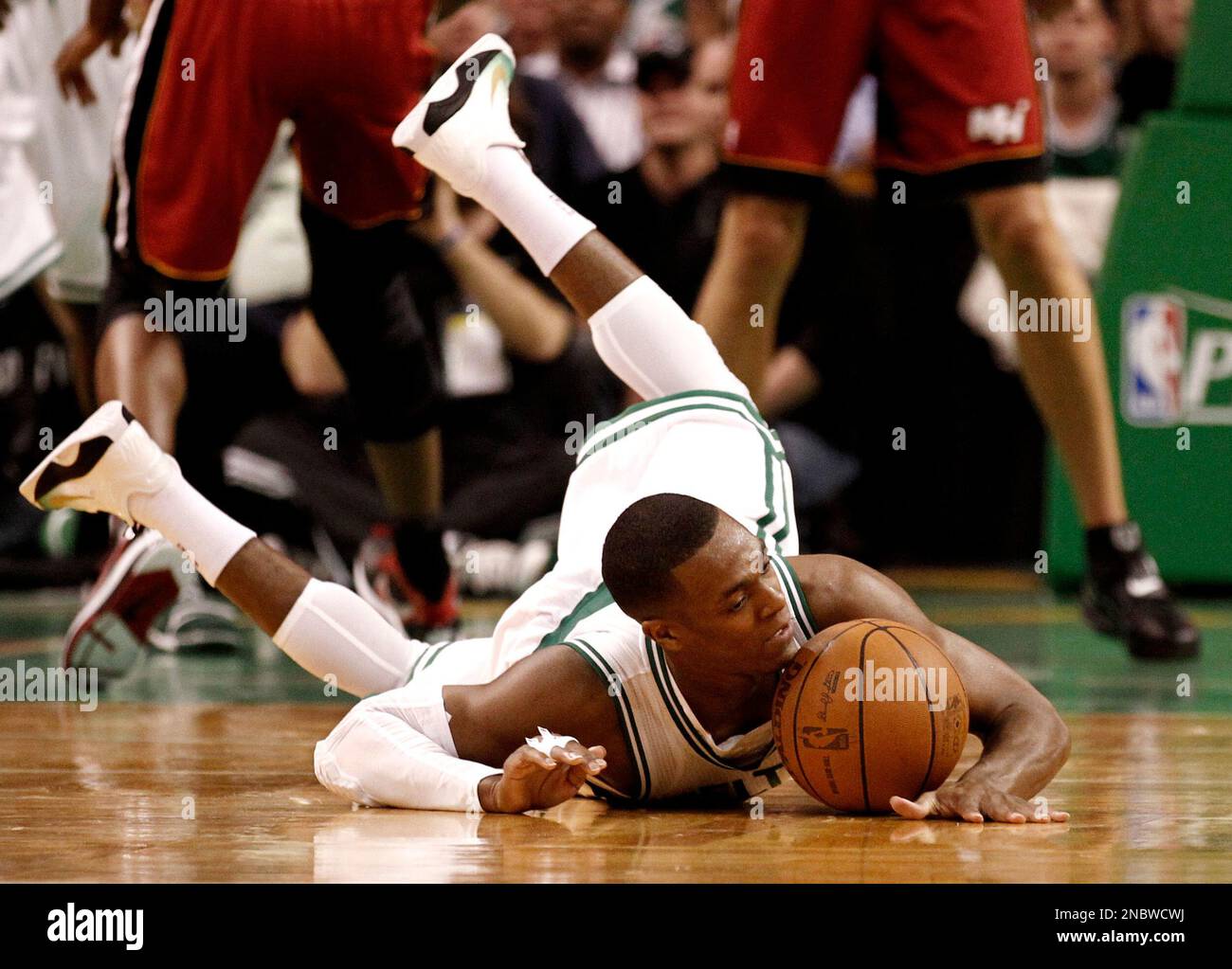 Boston Celtics' Rajon Rondo hits the floor after being tripped during ...