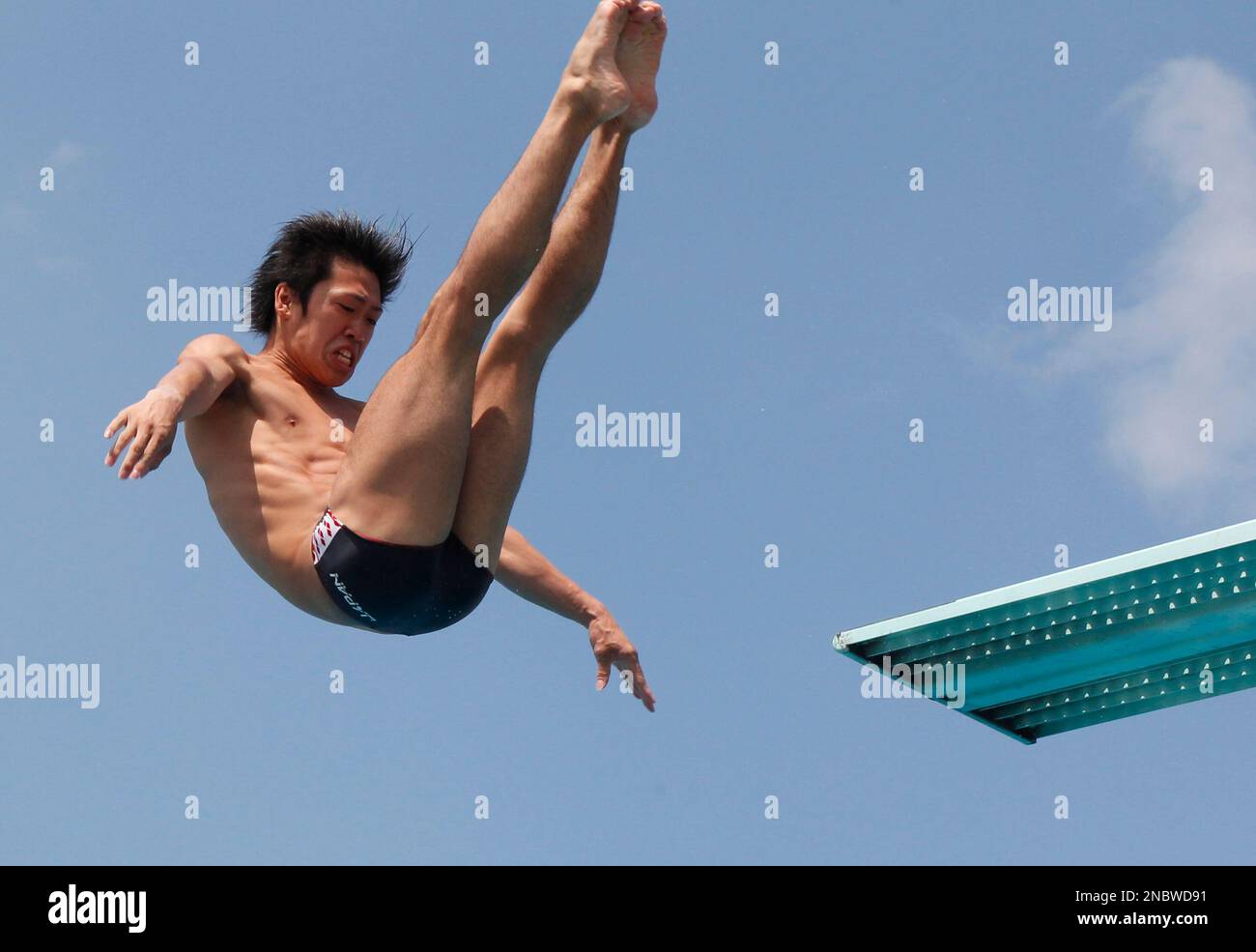 Sho Sakai of Japan, competes during the men's three-meter springboard ...