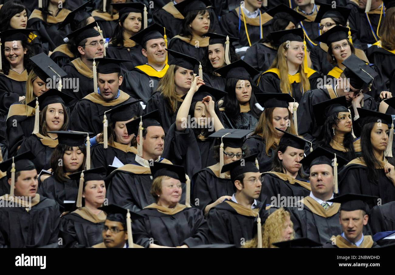 Students wait to be called for their degree during the University of ...