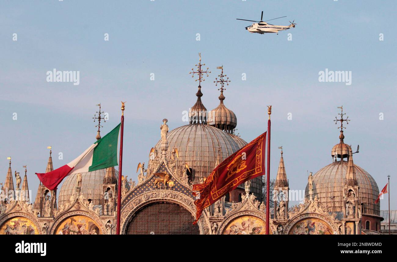 The Italian Airforce helicopter carrying Pope Benedict XVI flies over ...