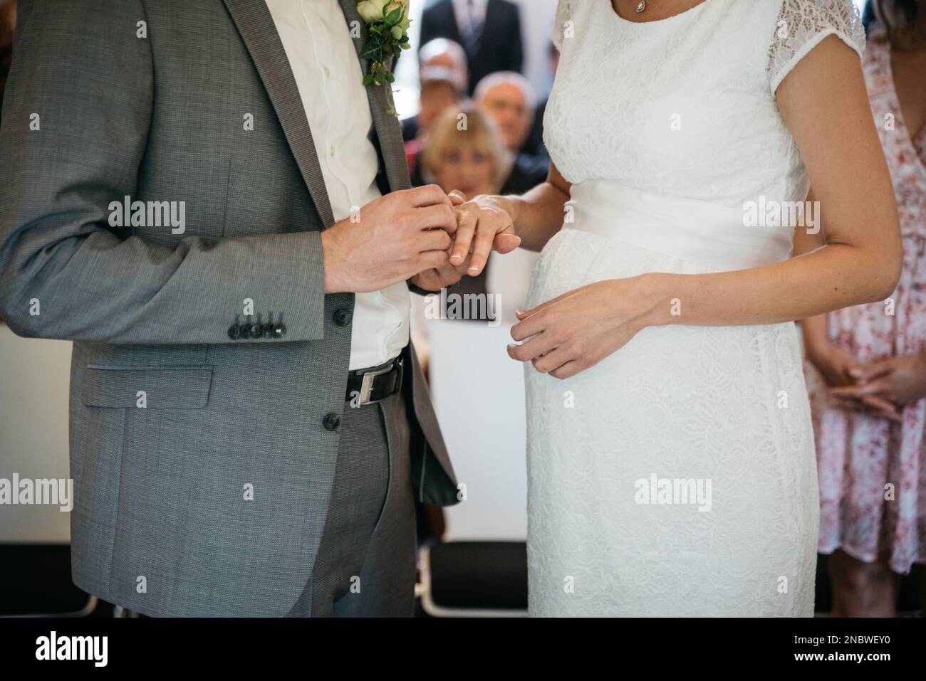 Bride puts ring on hi-res stock photography and images - Alamy