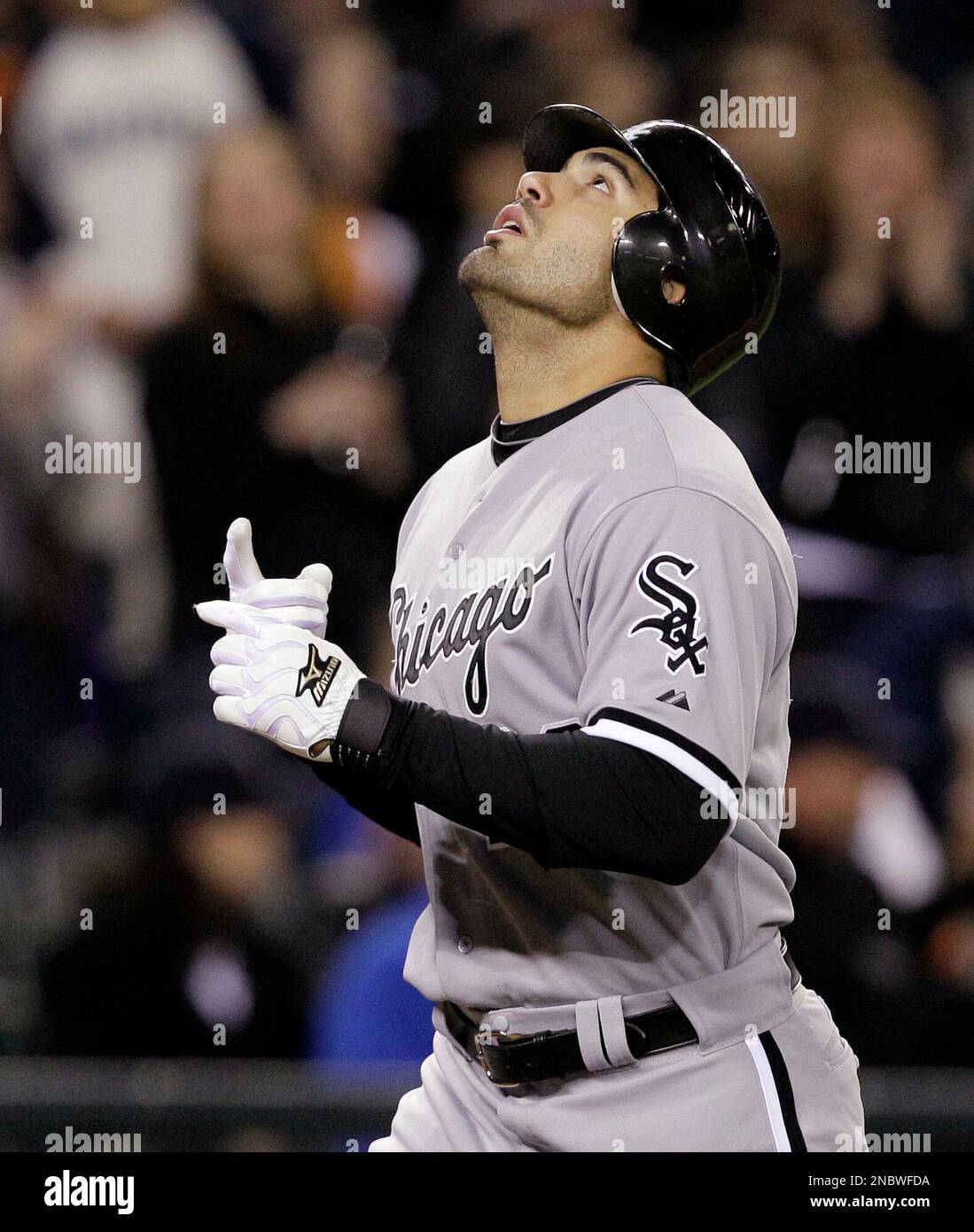 Chicago White Sox's Carlos Quentin glances skyward just before crossing ...
