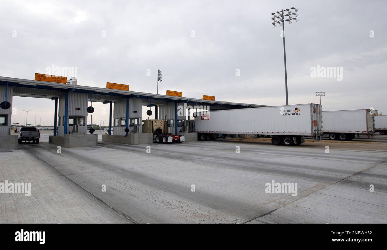 Truckers pass through inspection booths for commercial traffic heading ...