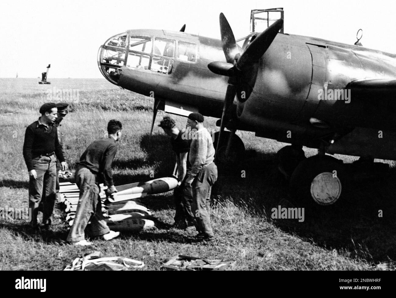 A French crew loading bombs into an American-made bomber in preparation ...