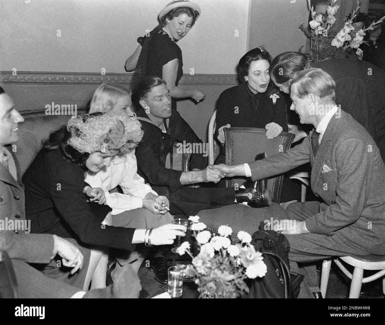 The Duke of Windsor, Prince Edward, right, shakes hands with Jack Shea ...