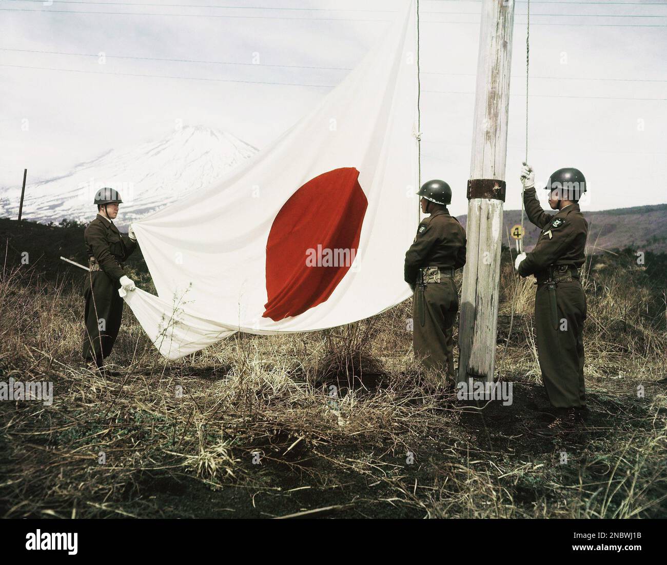 Japanese honor guard soldiers raise “Rising Sun” flag of Japan at the ...