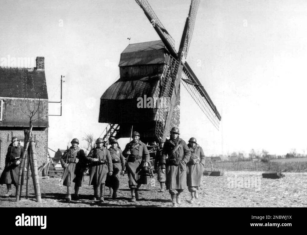 French troops guarding their northern coast pass an old windmill in ...