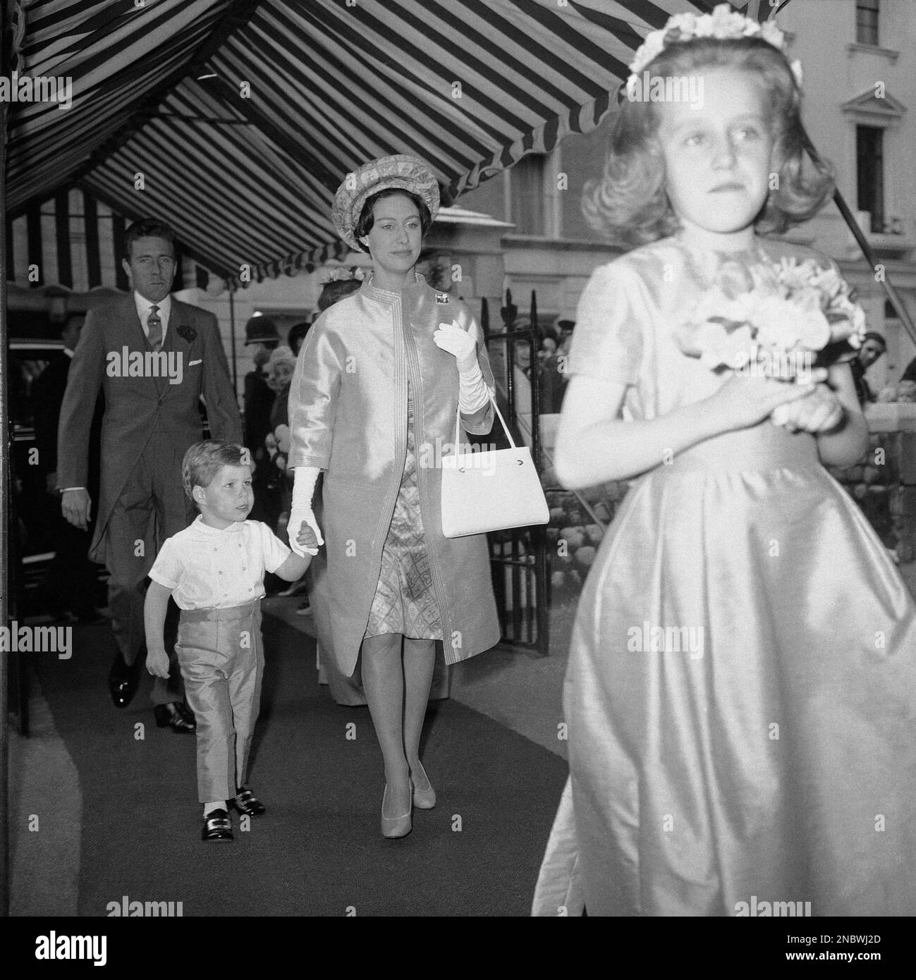 Princess Margaret, followed by her husband Lord Snowdon, leads her son ...