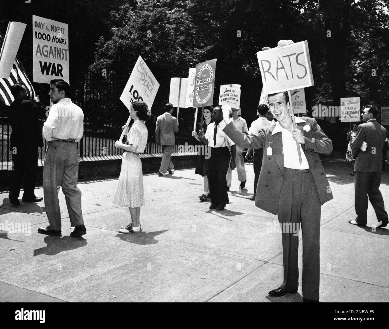 Walking holding placard western script protest Black and White Stock ...