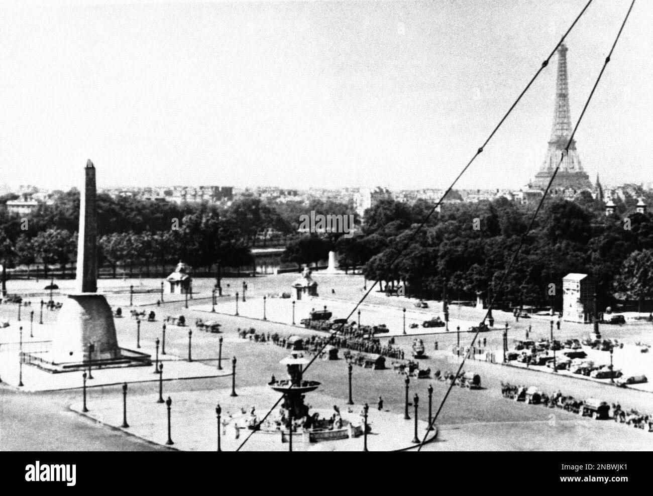 German troops passing in Paris on June 14, 1940. Eiffel Tower is in ...
