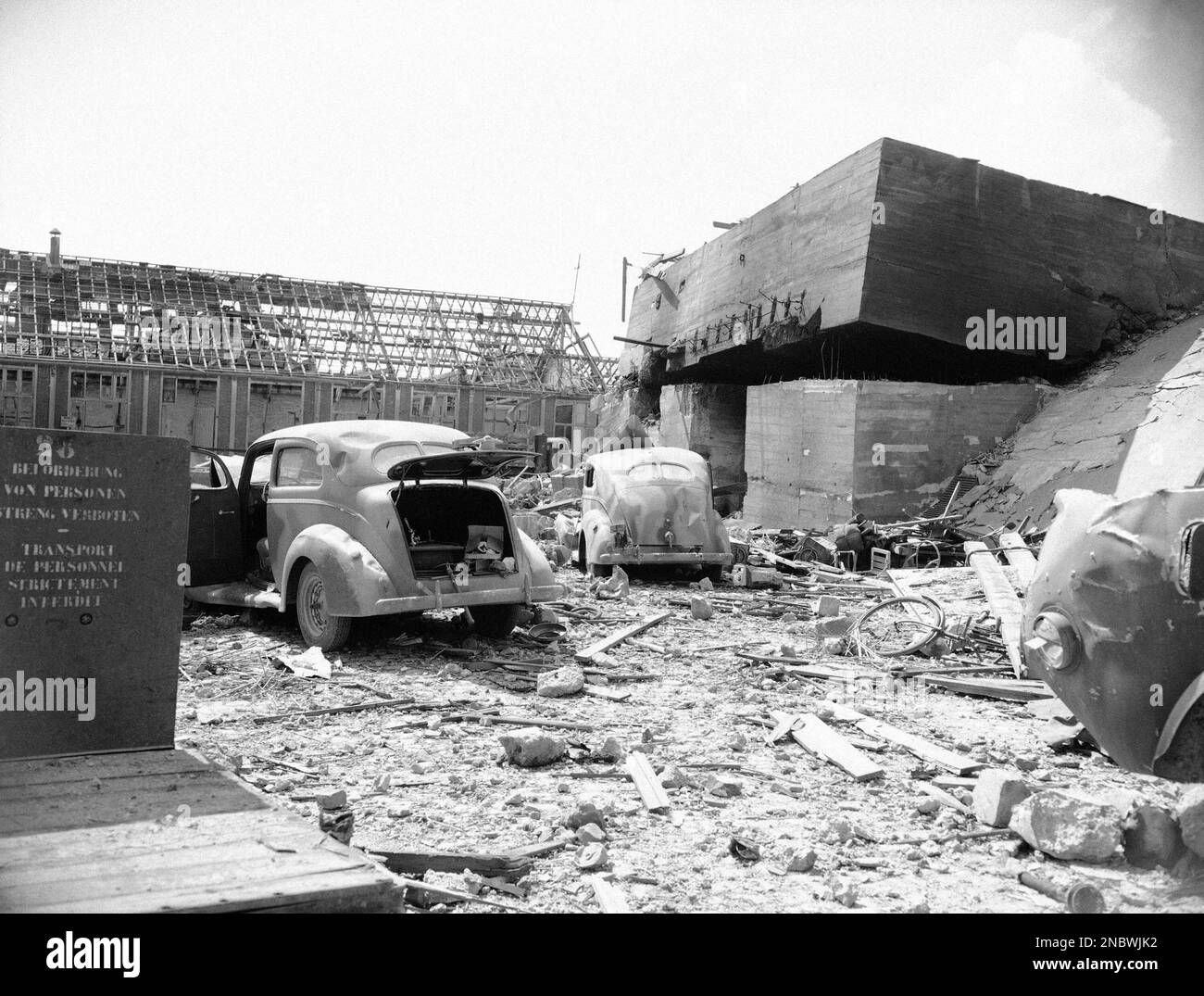 Wrecked cars and concrete buildings left by the Germans when they ...