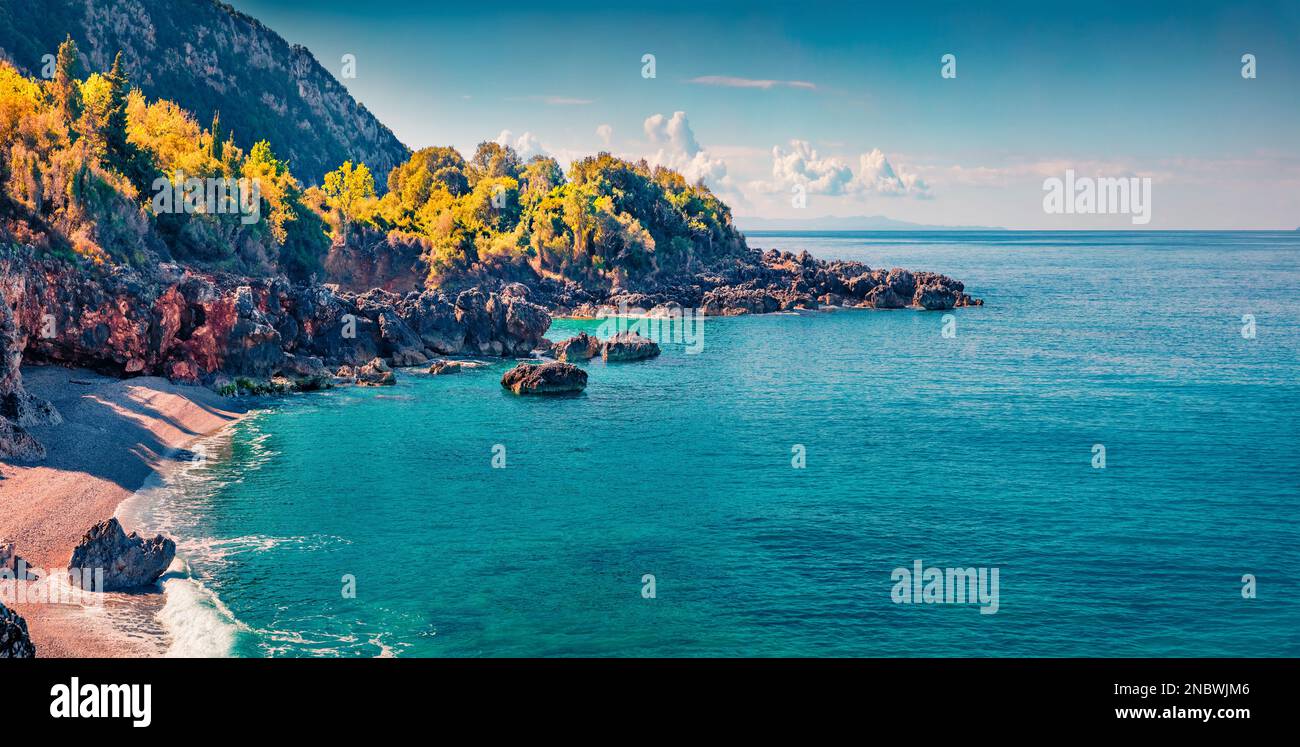 Panoramic spring view of publik beach in Dhermi town. Deep blue water ...