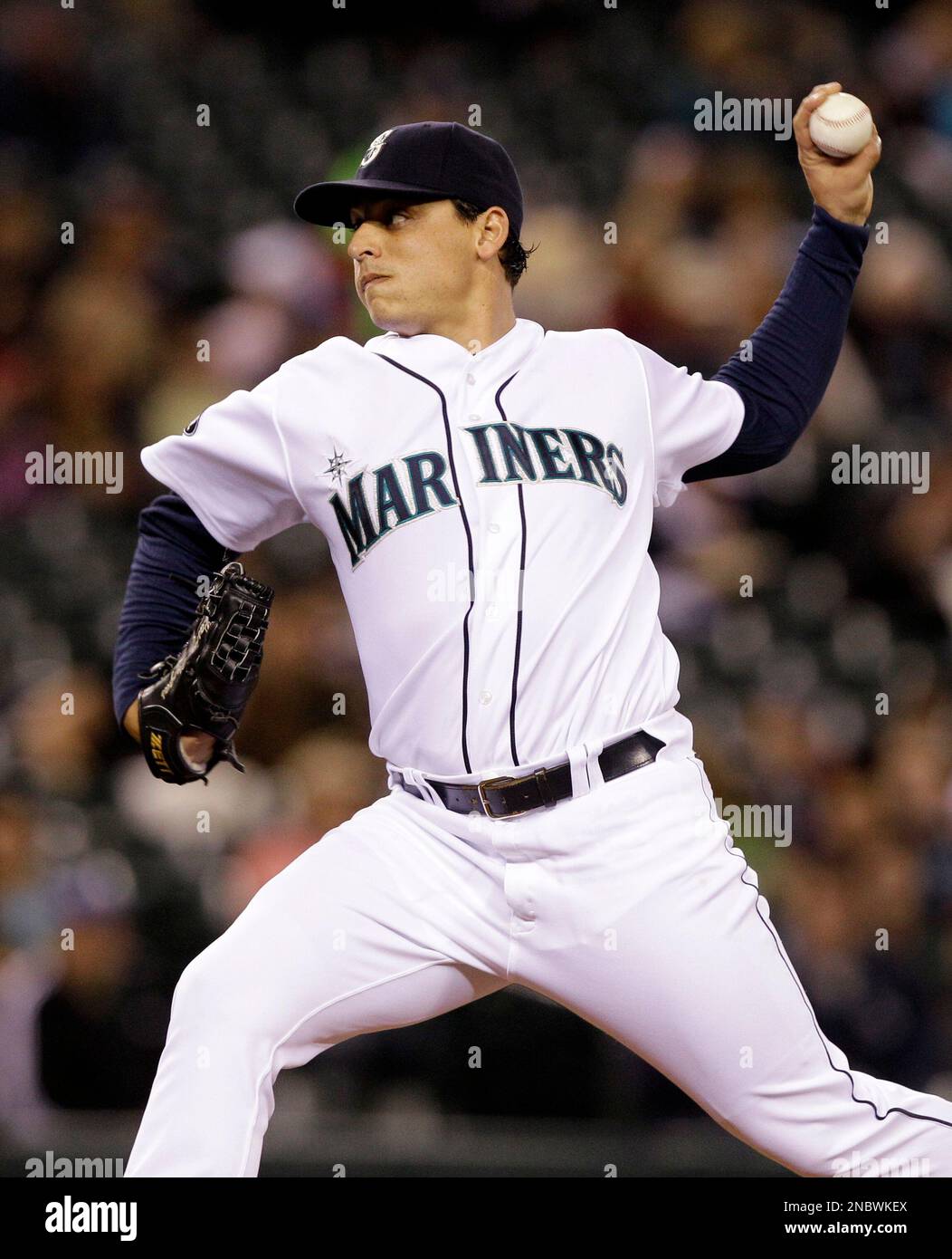Seattle Mariners starting pitcher Jason Vargas throws to the Texas ...