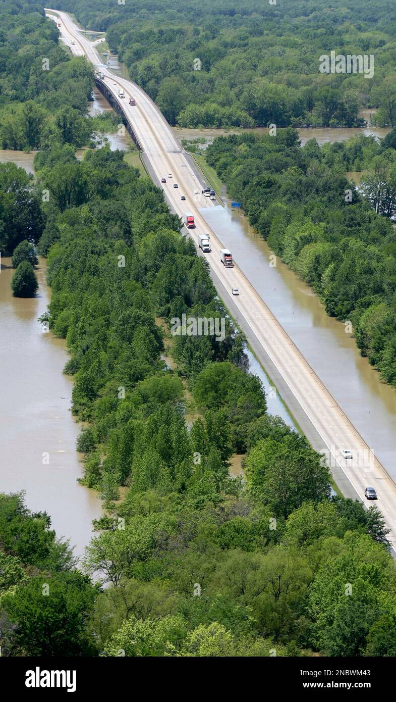 Water covers the west-bound lane of Interstate 40 on the approach to ...