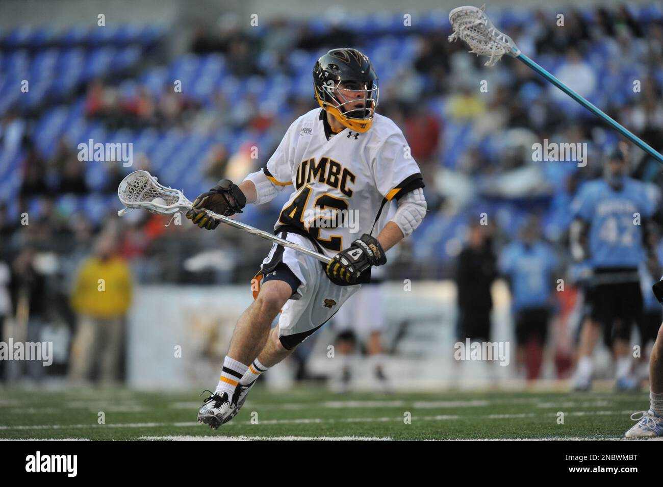 UMBC's midfielder Scott Hopmann (42) runs the ball against Johns ...