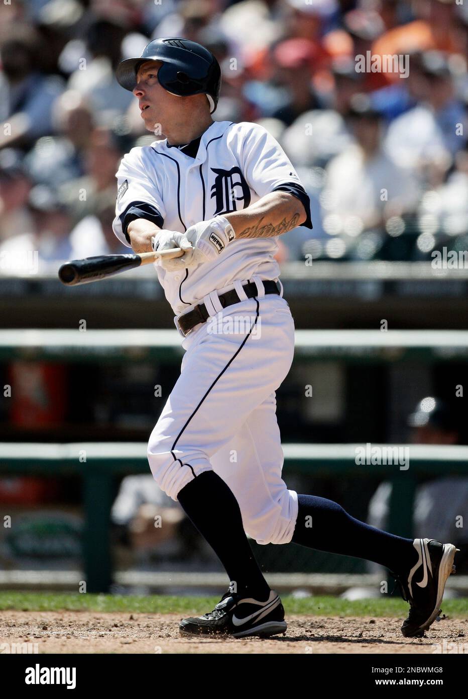 Detroit Tigers' Brandon Inge watches his sacrifice fly ball that scored ...