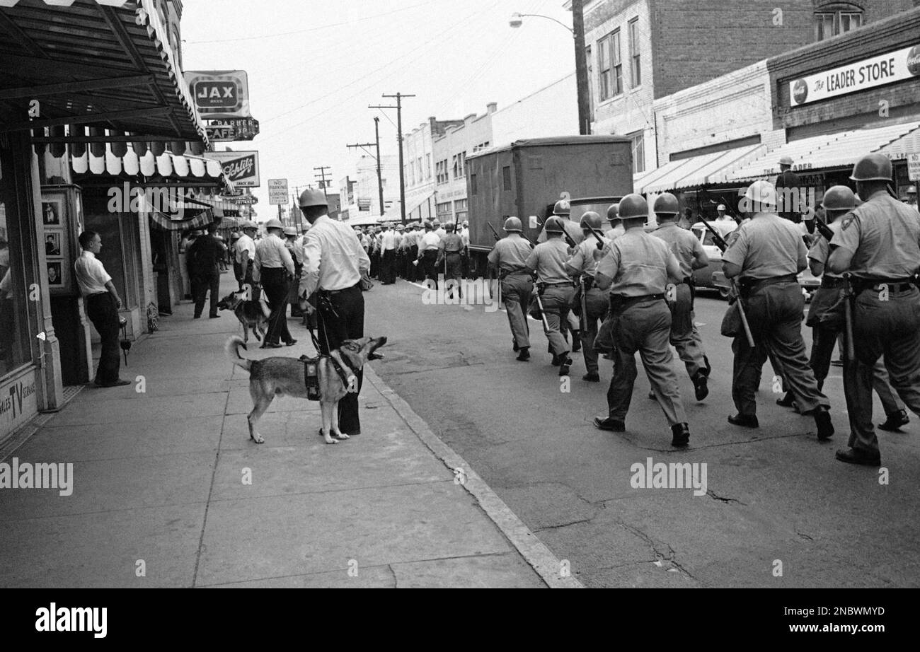 Mississippi Highway Patrolmen with shotguns at high port move up to ...