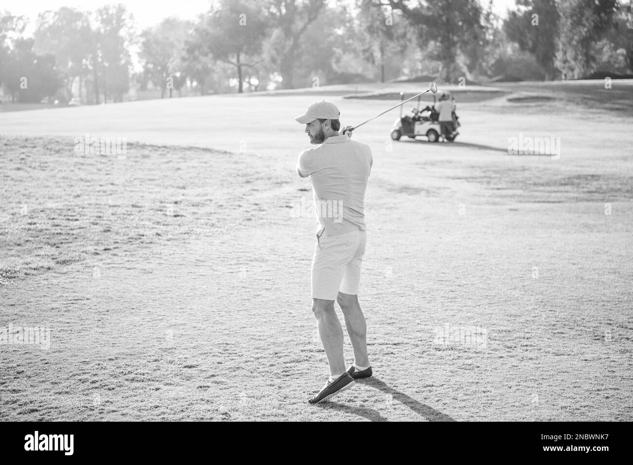 male golf player on professional sunny course with green grass, hobby ...
