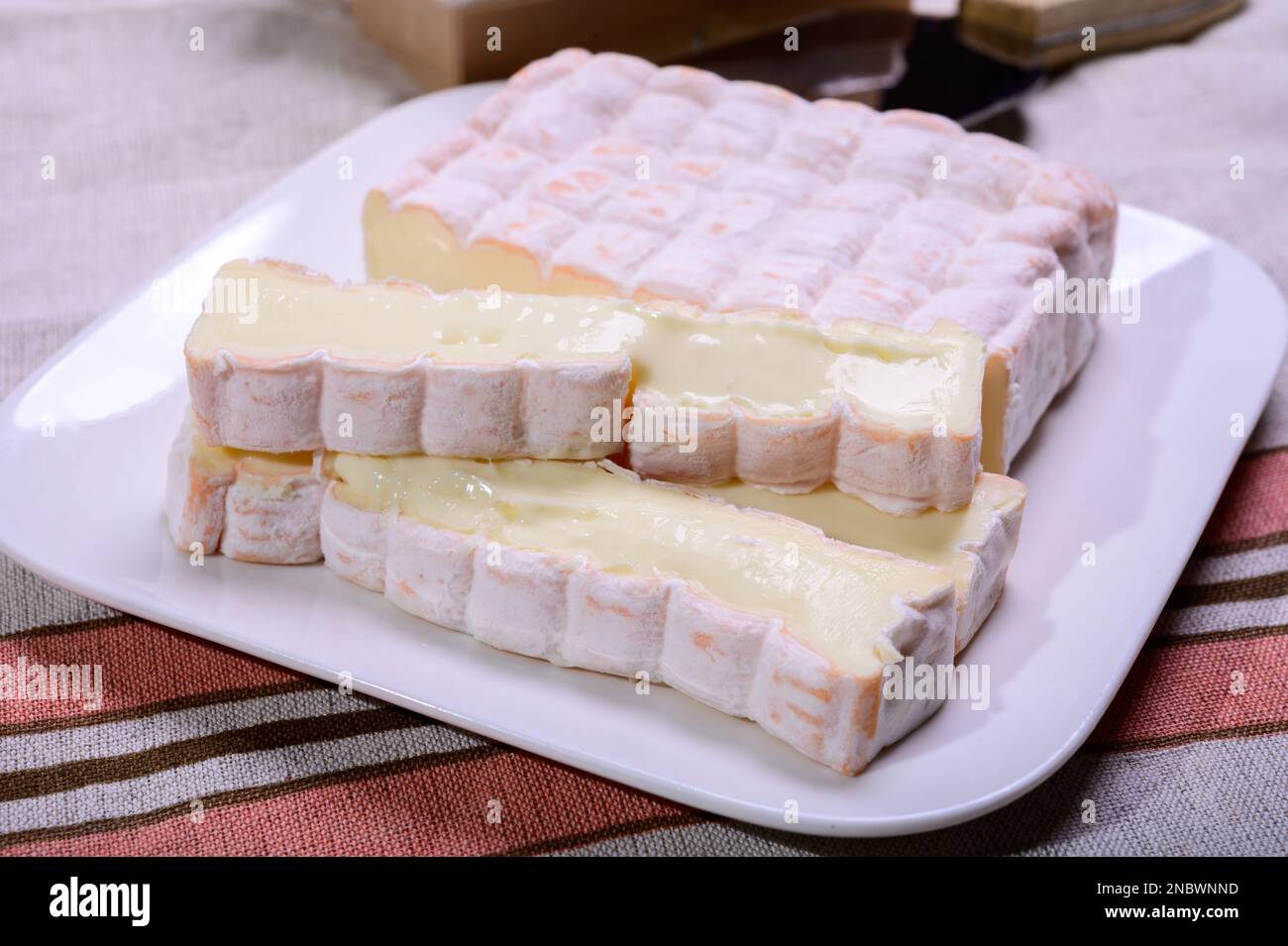 French cheeses collection, yellow Vieux Pane cheese with white mold ...