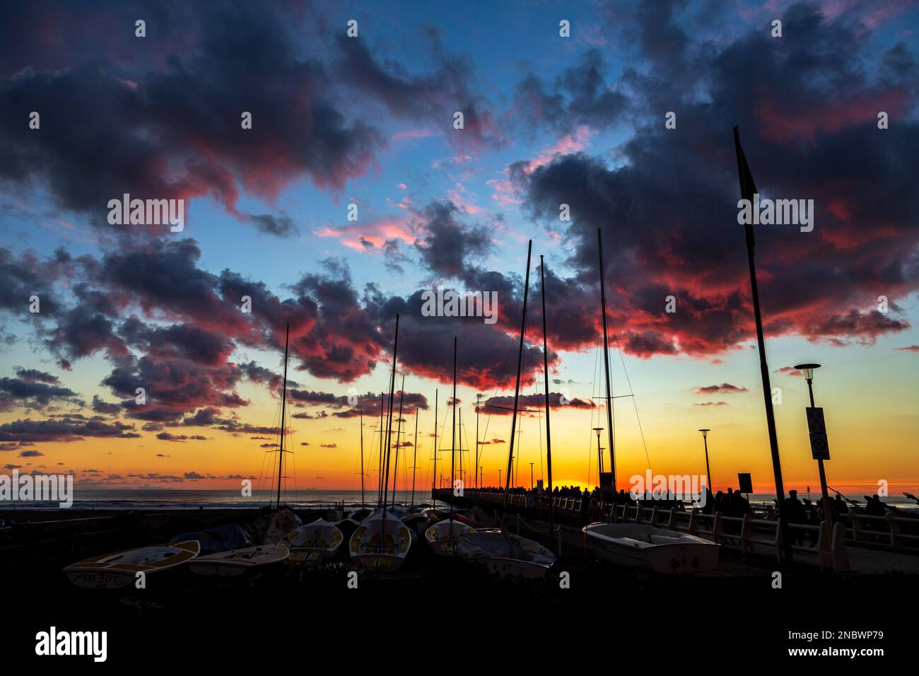 The Brighton Marina busy yacht harbor at sunset with purple and fiery ...